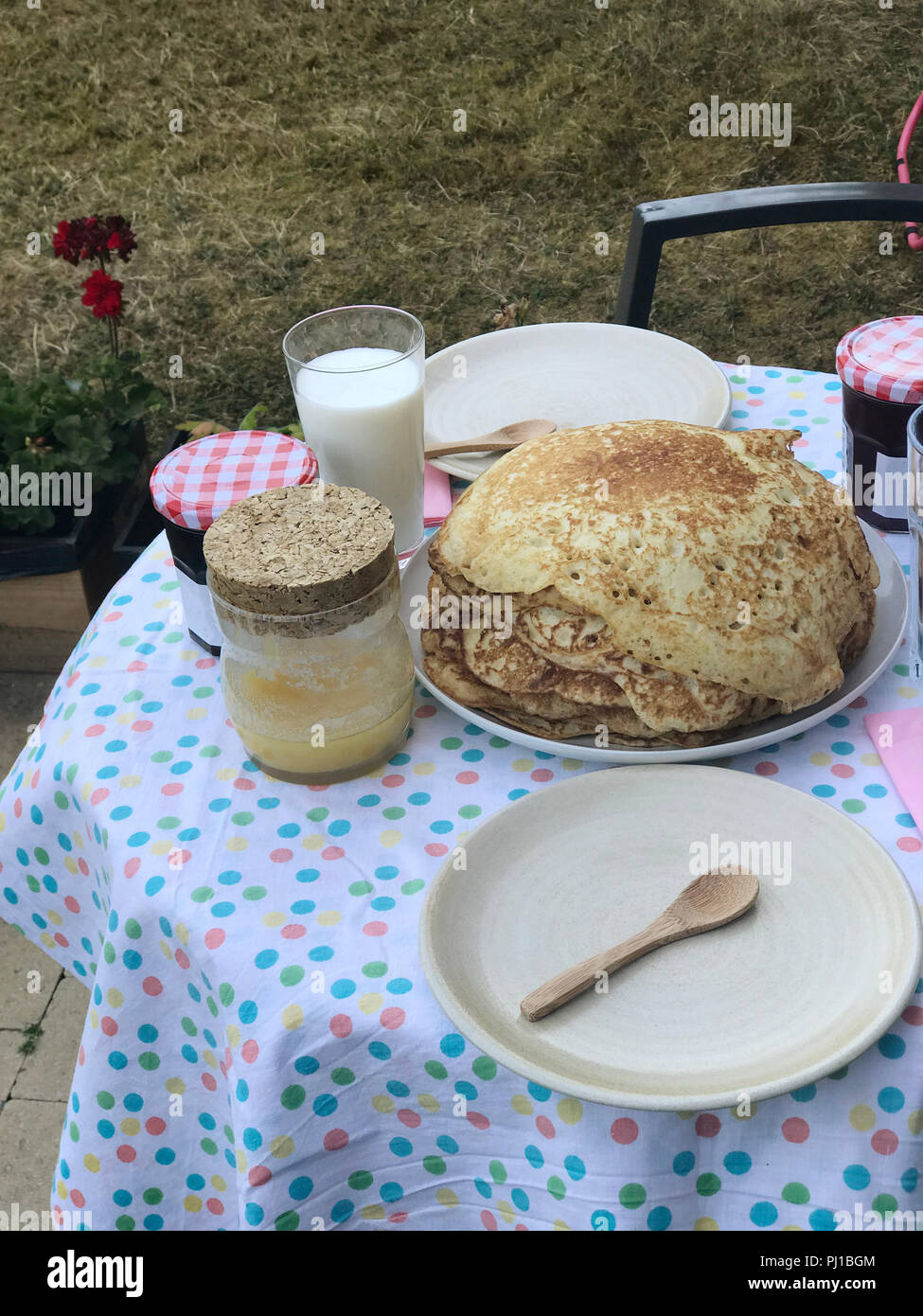 Stack of pancakes with jam on a breakfast table Stock Photo - Alamy
