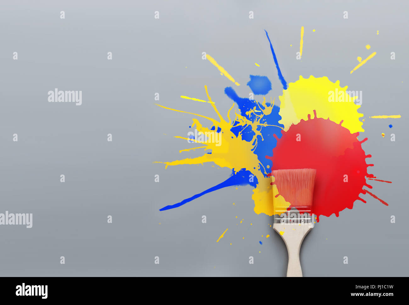 Various colours of paint splattered over a brush Stock Photo - Alamy