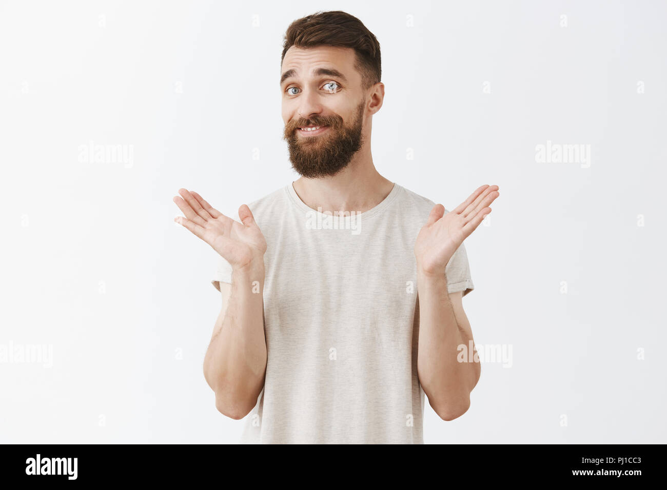 Portrait of tricky careless and stylish handsome male with long hipster ...