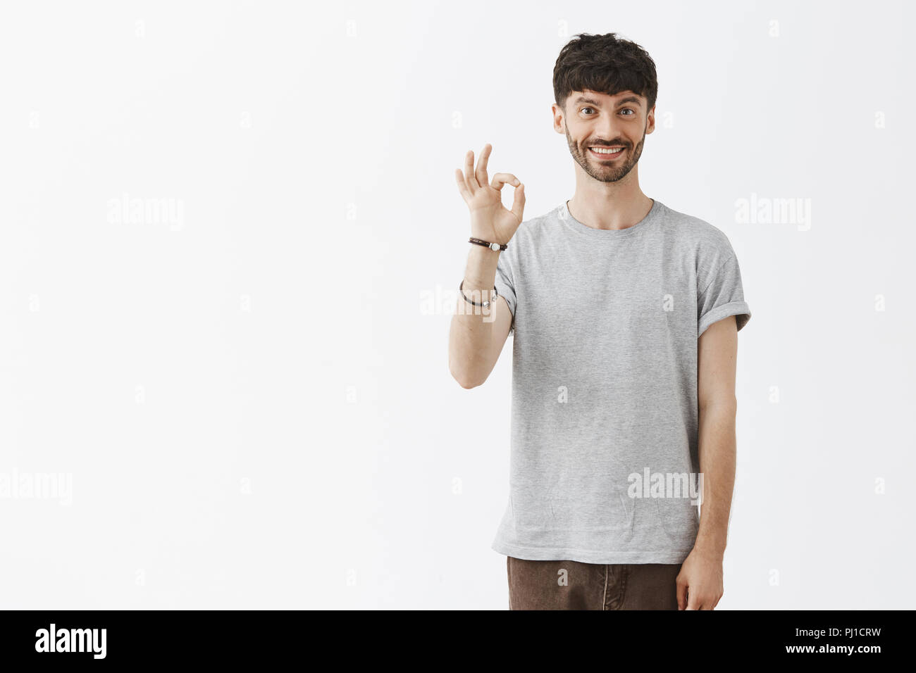 Happy man giving okay sign hi-res stock photography and images - Alamy