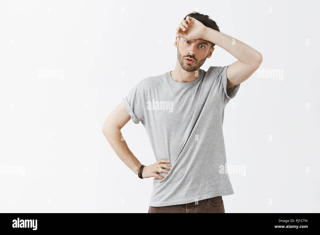 Man feeling relieved escaping from dangerous situation whiping sweat ...