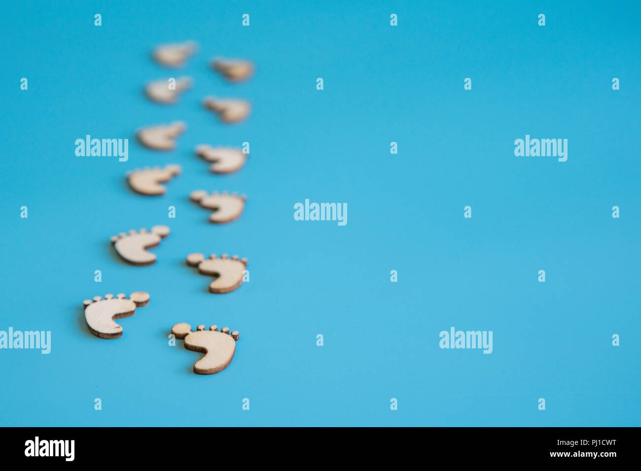 Footprints on a blue background. copy space Stock Photo - Alamy