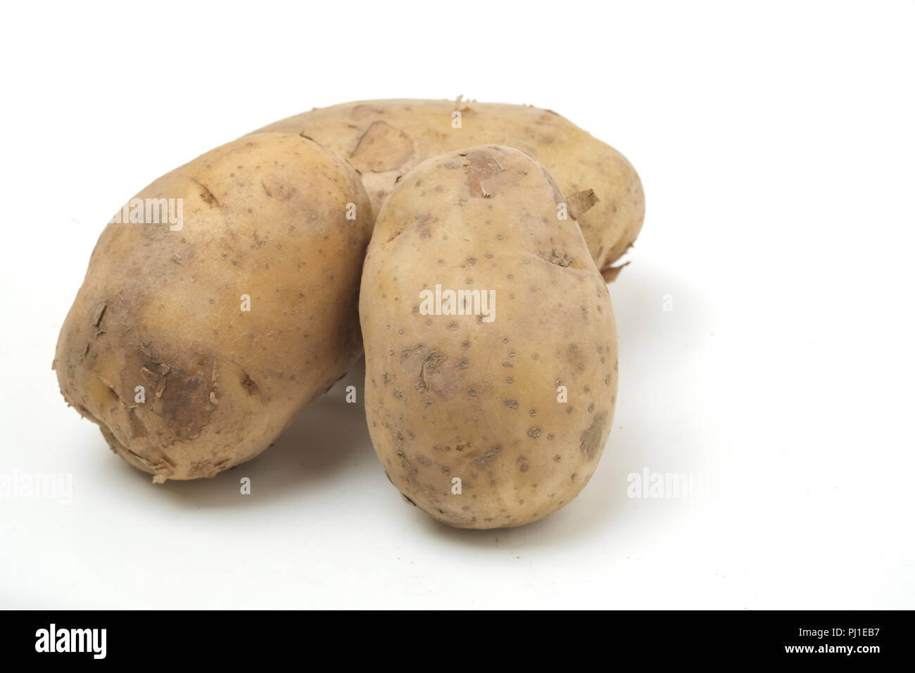 fresh potato white background Stock Photo - Alamy