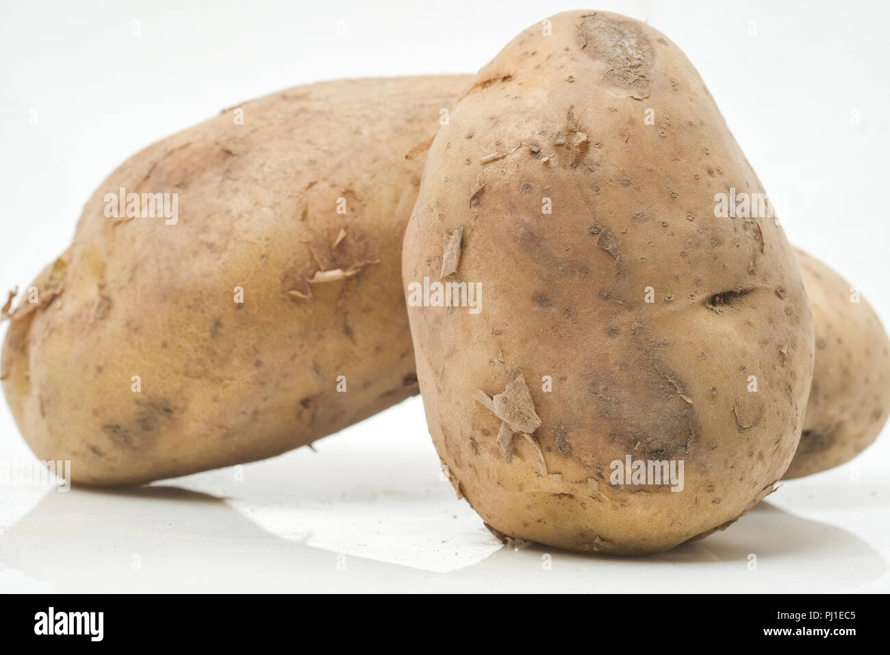 fresh potato white background Stock Photo - Alamy