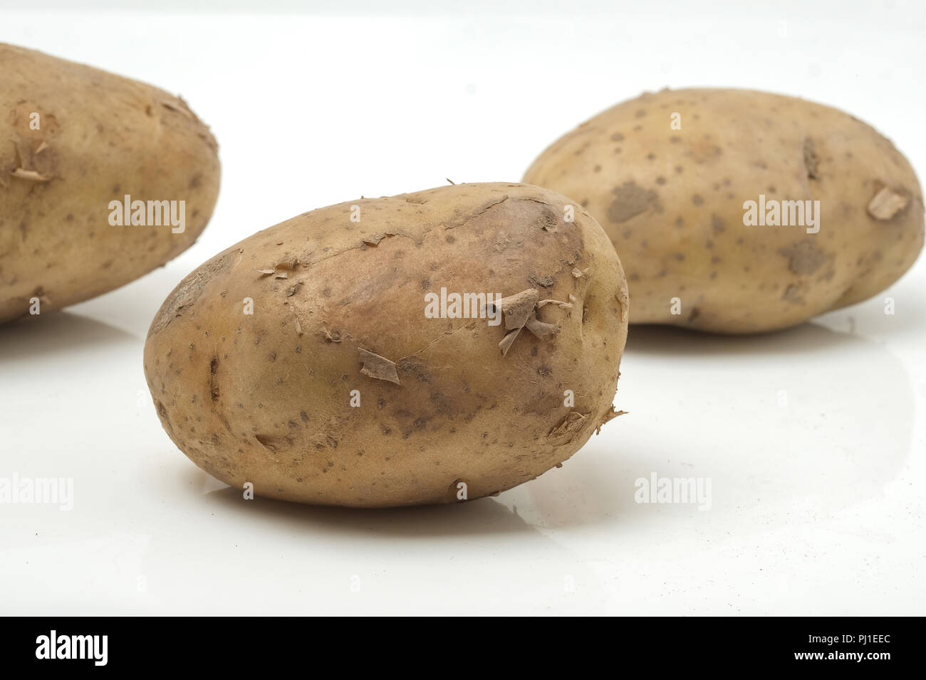 fresh potato white background Stock Photo - Alamy