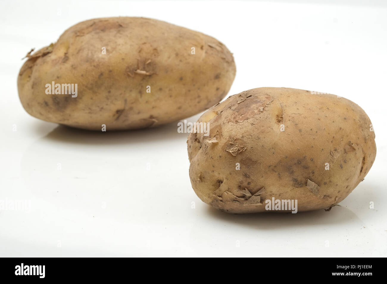 fresh potato white background Stock Photo - Alamy
