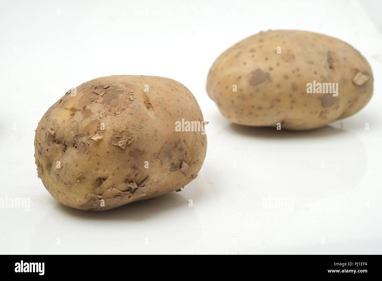 fresh potato white background Stock Photo - Alamy