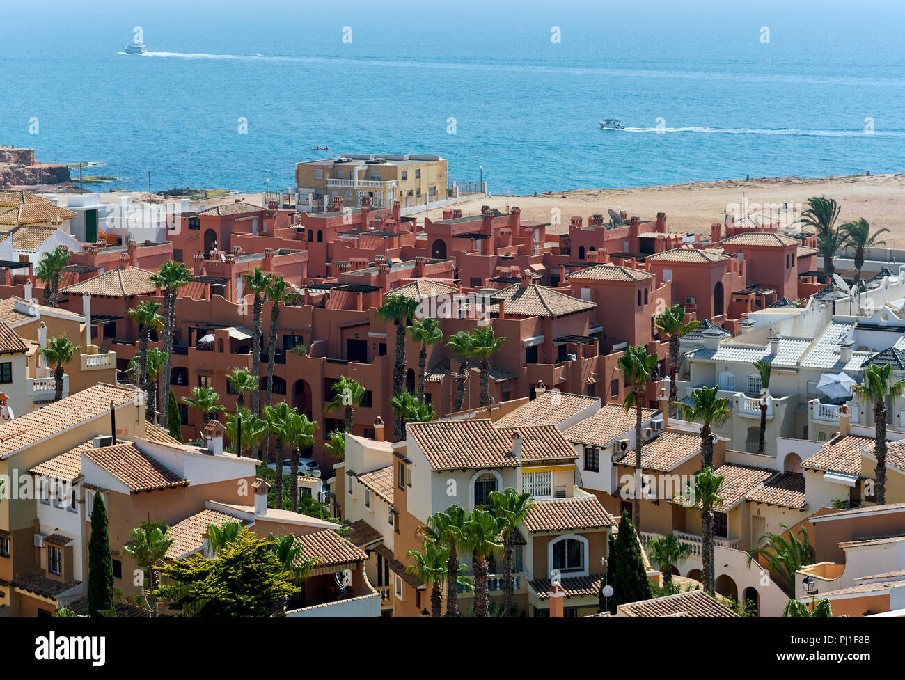 Seaside of Torrevieja city in summertime. Coastal residential buildings ...