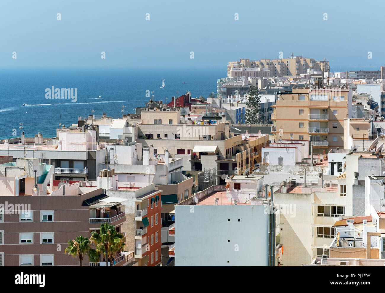 Seaside of Torrevieja city in summertime. Coastal residential buildings ...
