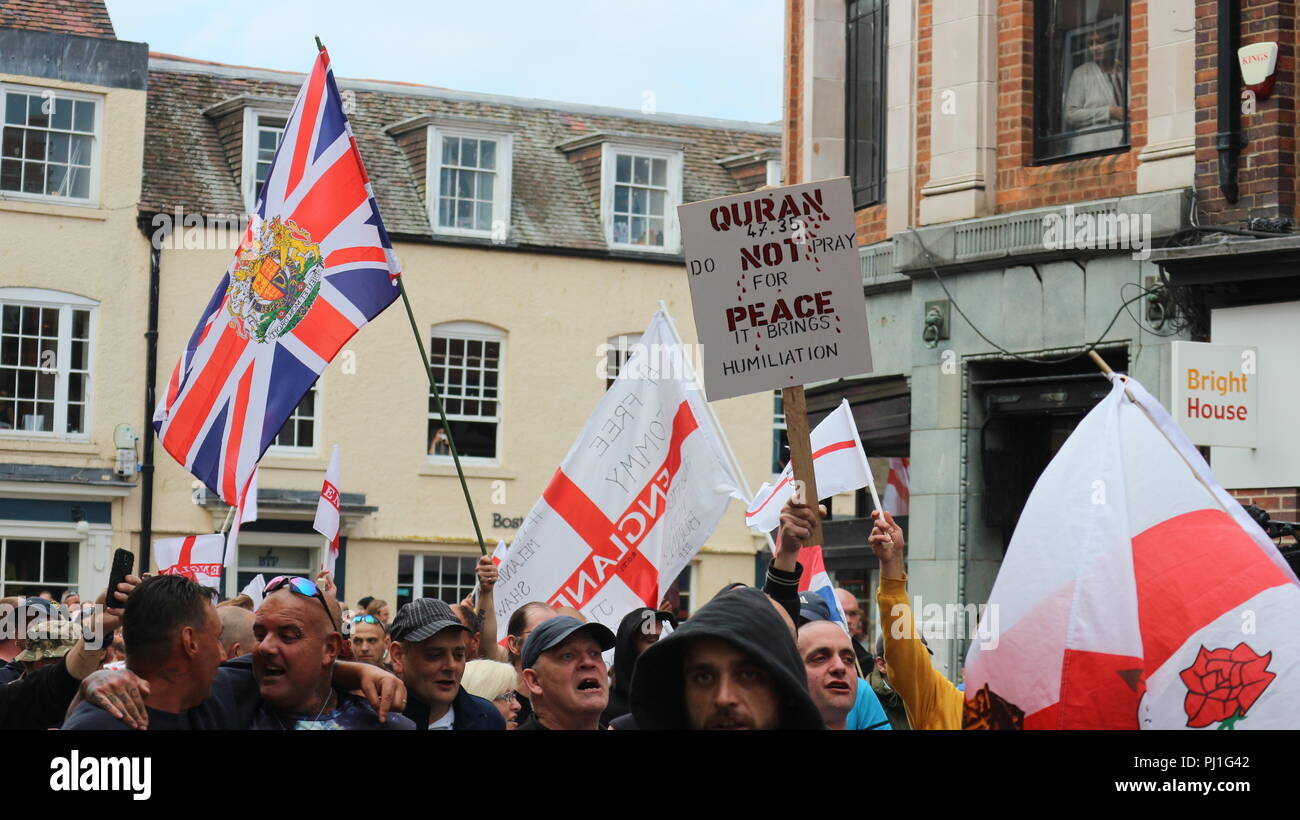 A group of EDL protesters holding flags and a banner in Worcester city ...