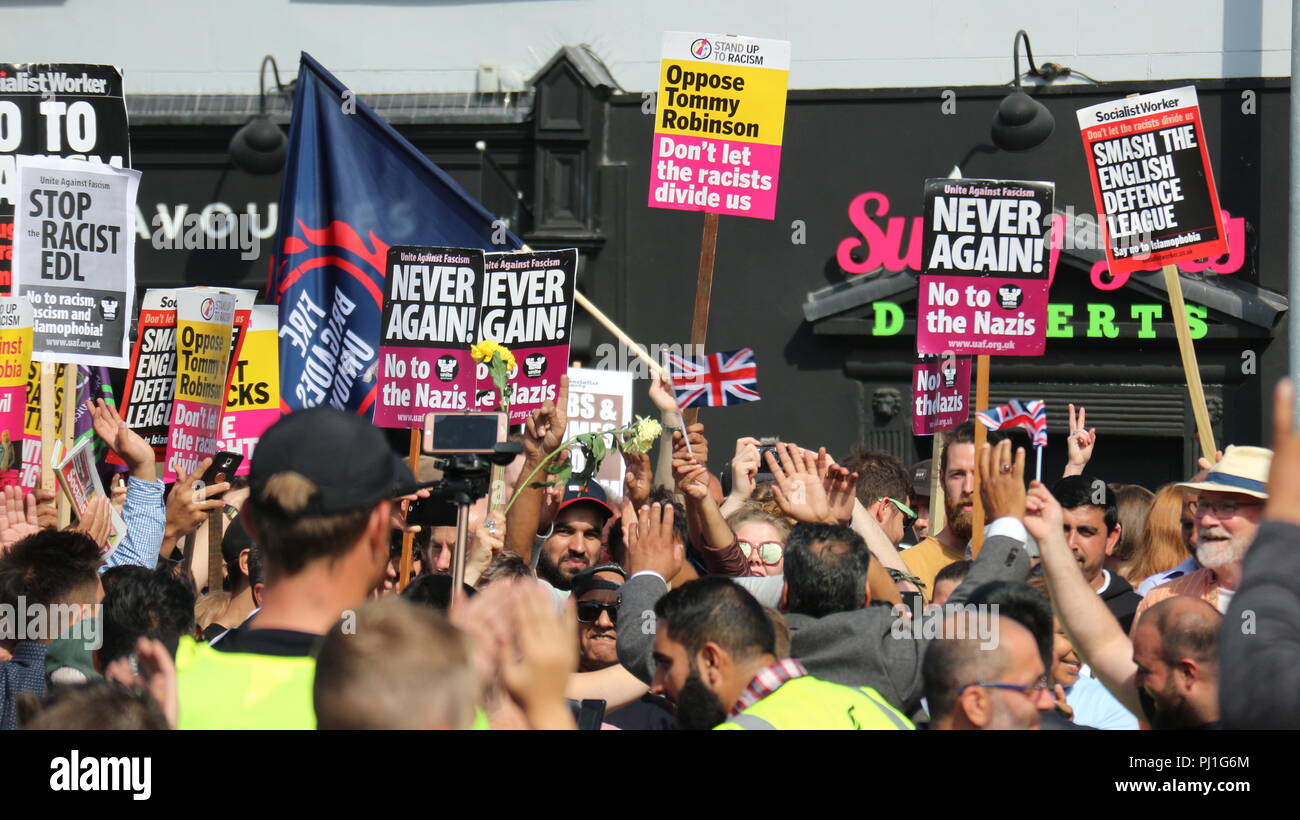 A group of people holding slogans at an EDL protest in Worcester, UK ...