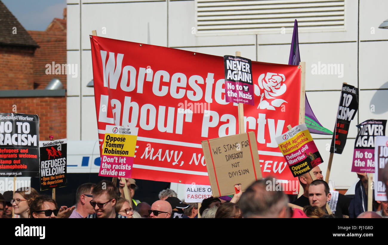 Close up of people holding slogans and a Worcester Labour Party banner ...