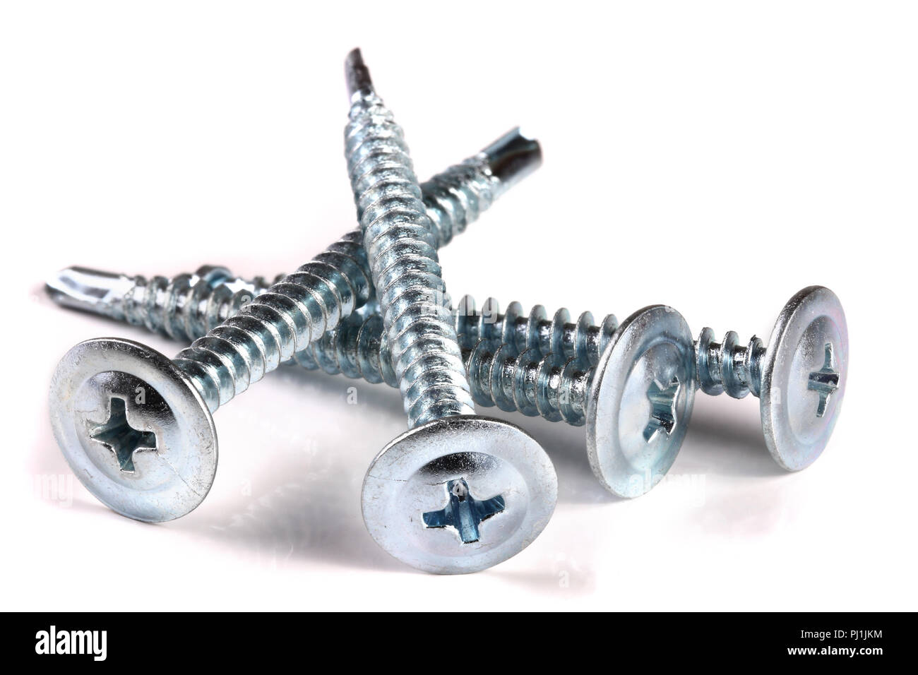 metal screws isolated on white background closeup Stock Photo - Alamy