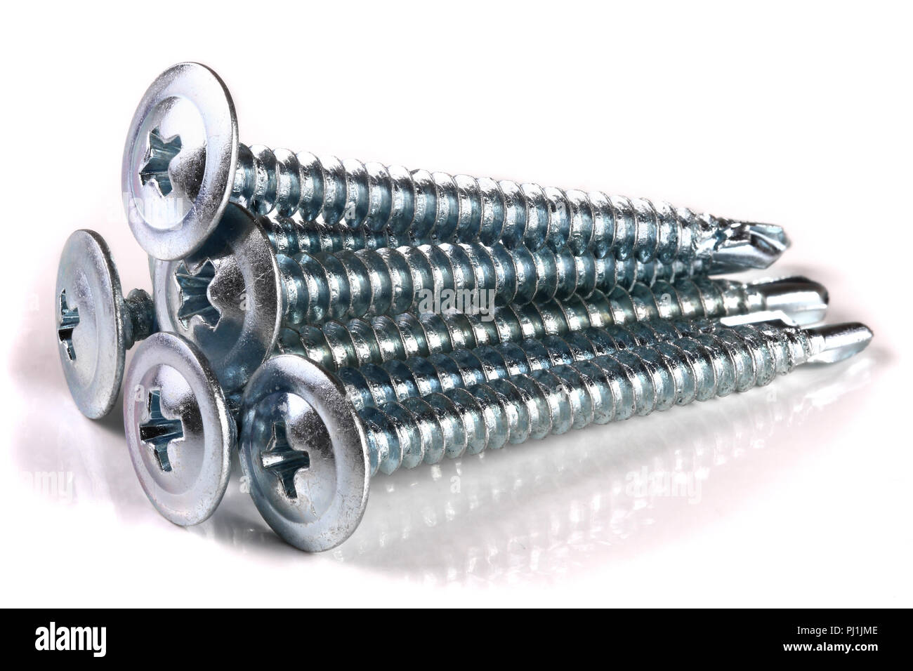 metal screws isolated on white background closeup Stock Photo - Alamy