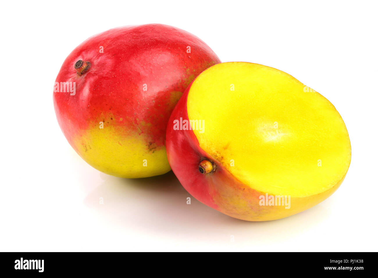 Mango fruit and half isolated on white background close-up Stock Photo ...