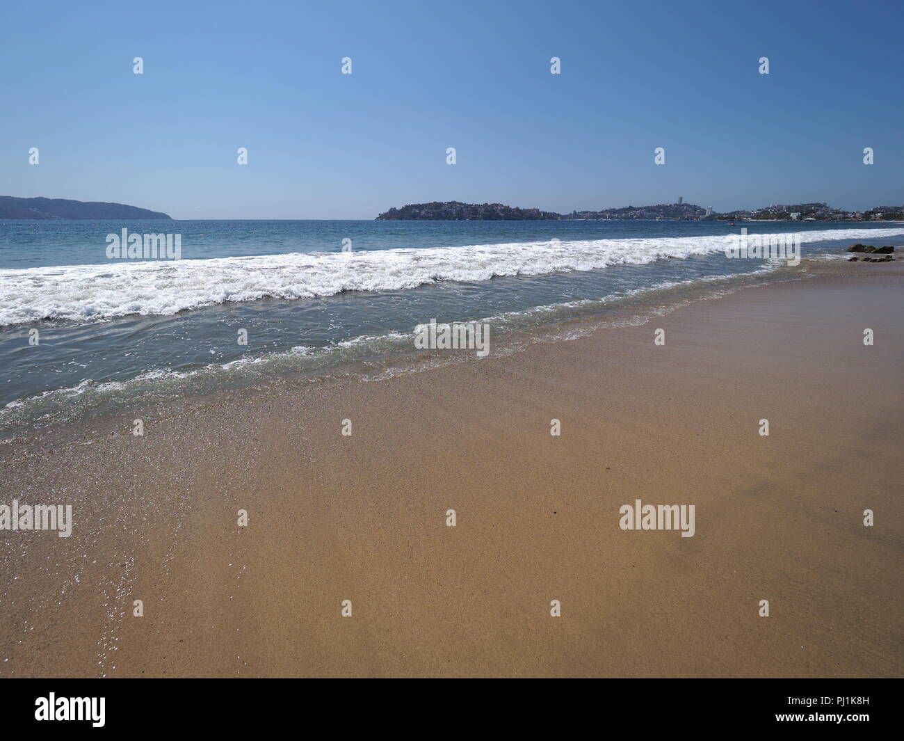 Wonderful panorama of sandy beach at bay of ACAPULCO city in Mexico ...
