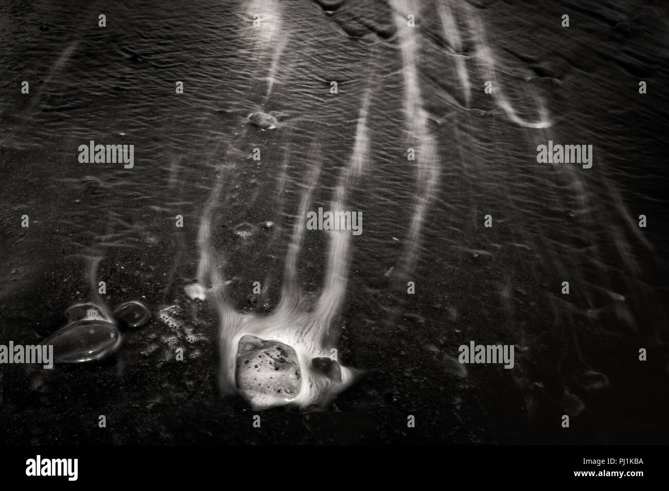 Tide movement on the beach Stock Photo - Alamy