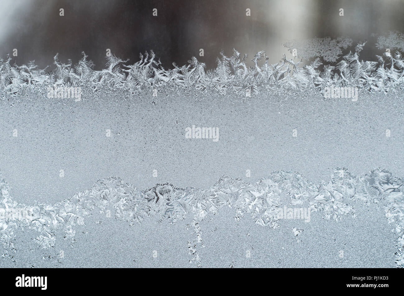 Frozen ice patterns on glass Stock Photo - Alamy