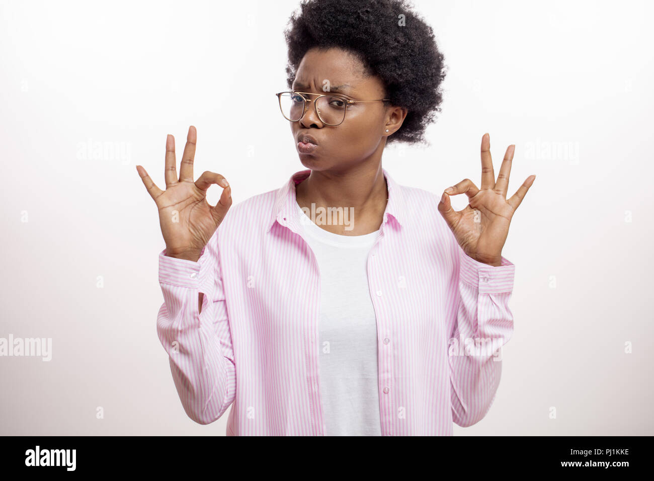 funny pretty woman showing OK sign Stock Photo - Alamy
