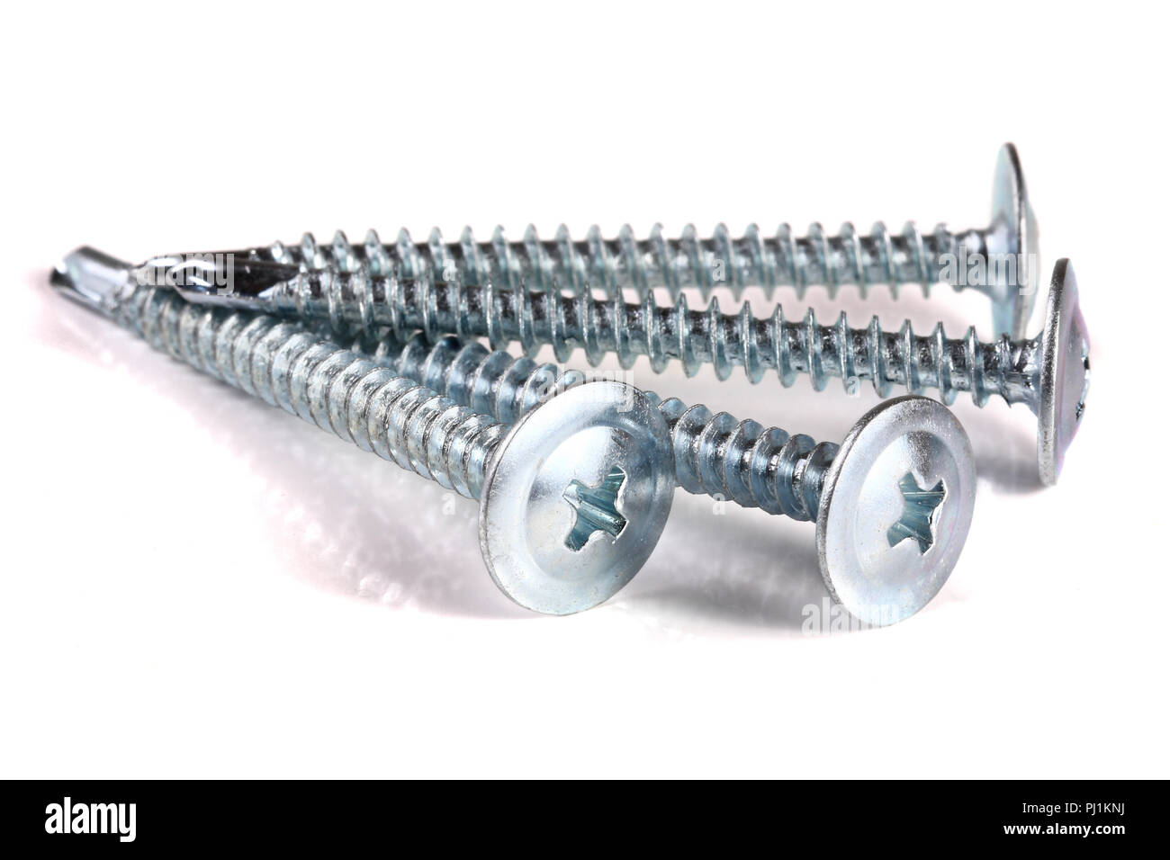 metal screws isolated on white background closeup Stock Photo - Alamy
