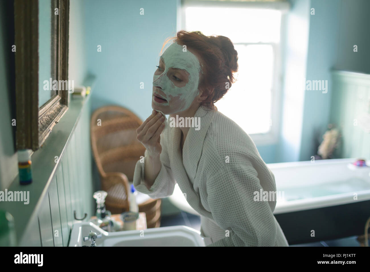 Removing the mask hi-res stock photography and images - Alamy