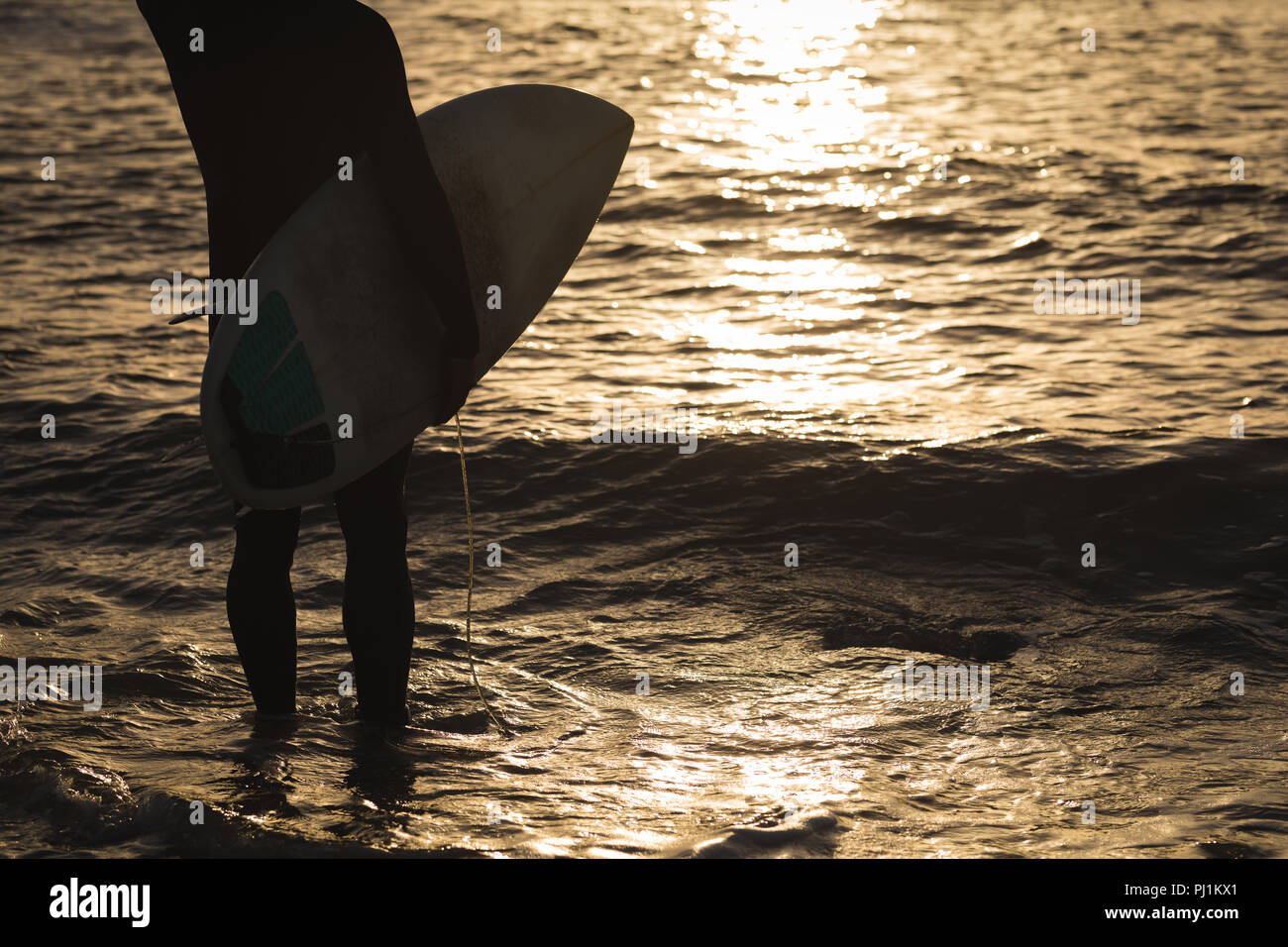 Surfer standing on beach hi-res stock photography and images - Alamy