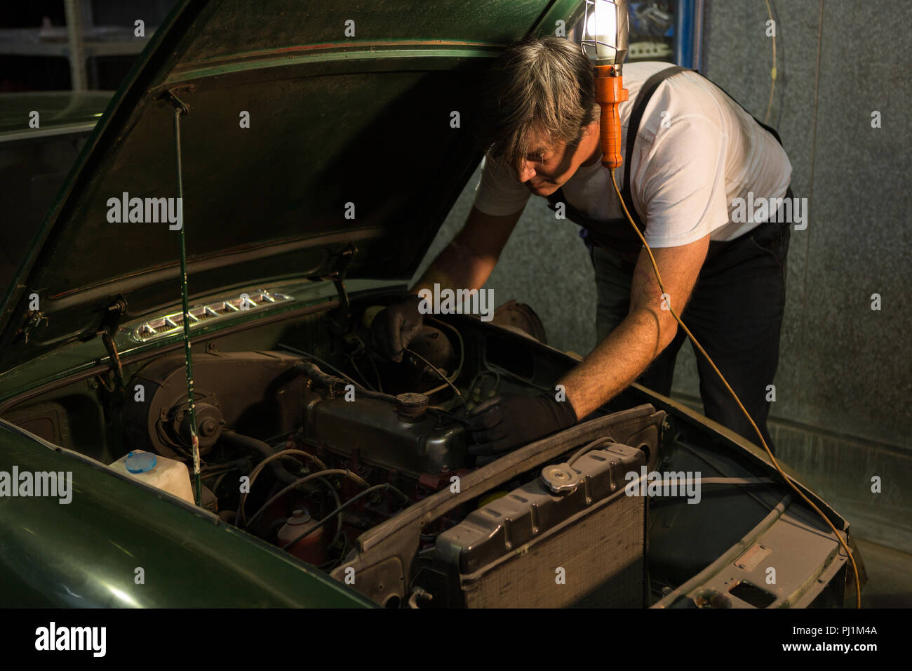 Vintage Car Garage Mechanic Working High Resolution Stock Photography ...