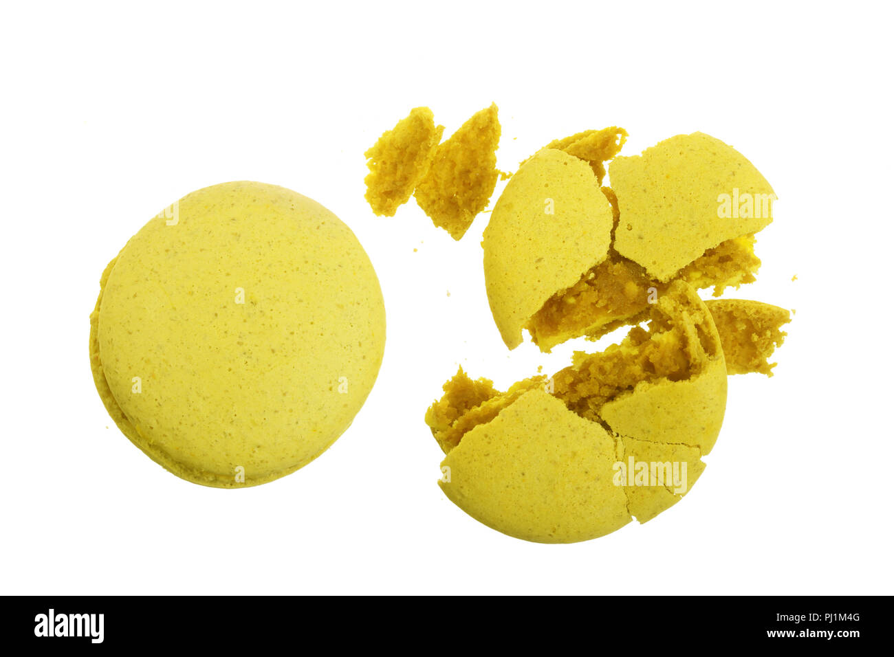 broken yellow macarons isolated on white background closeup Stock Photo ...