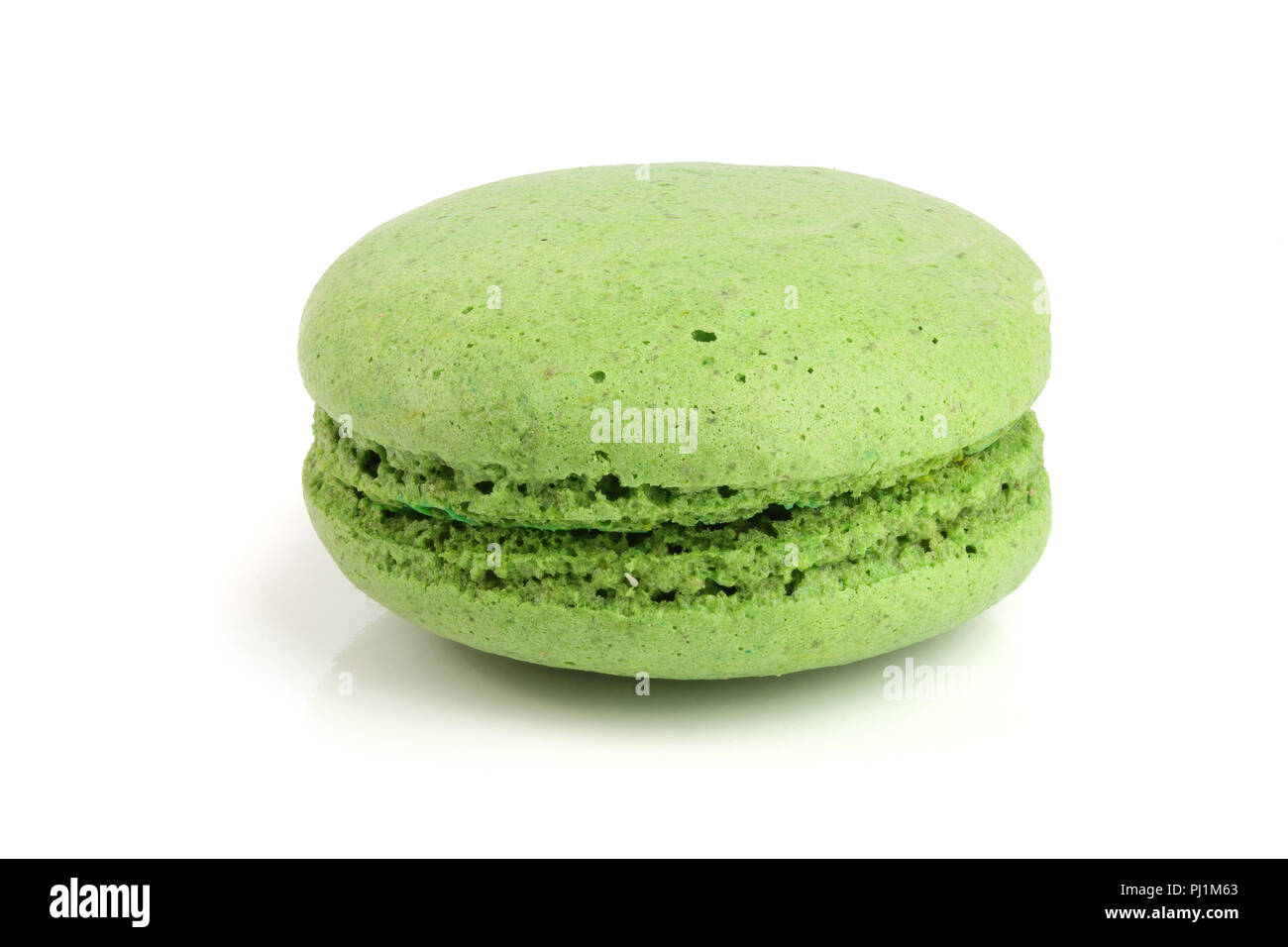 green macaron isolated on white background closeup Stock Photo - Alamy