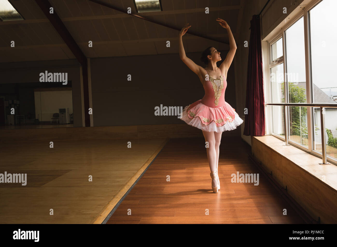 Ballerina practicing ballet dance in dance studio Stock Photo - Alamy