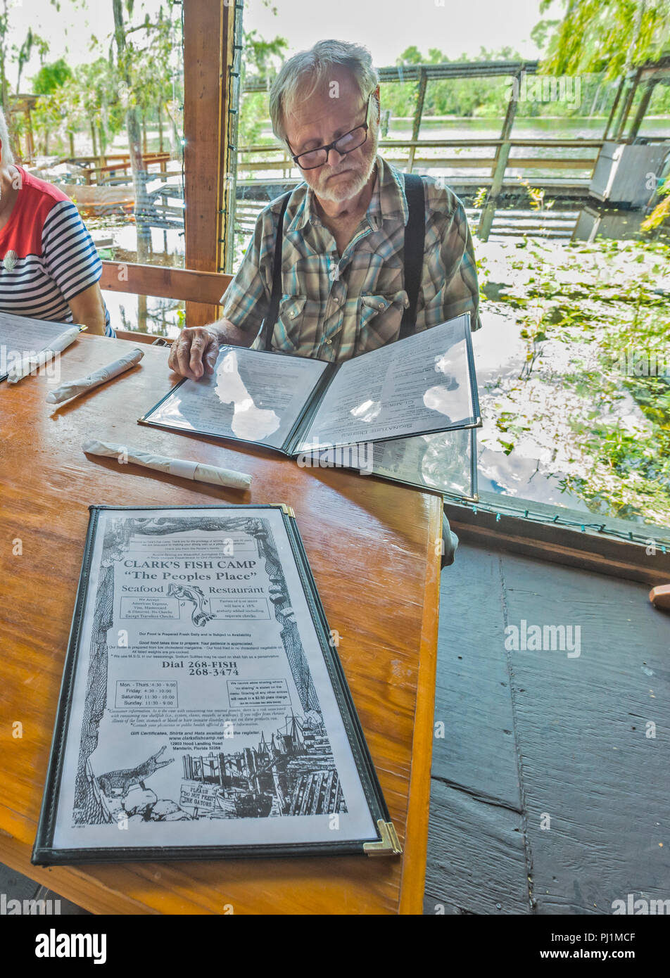 Senior man reading menu hi-res stock photography and images - Alamy