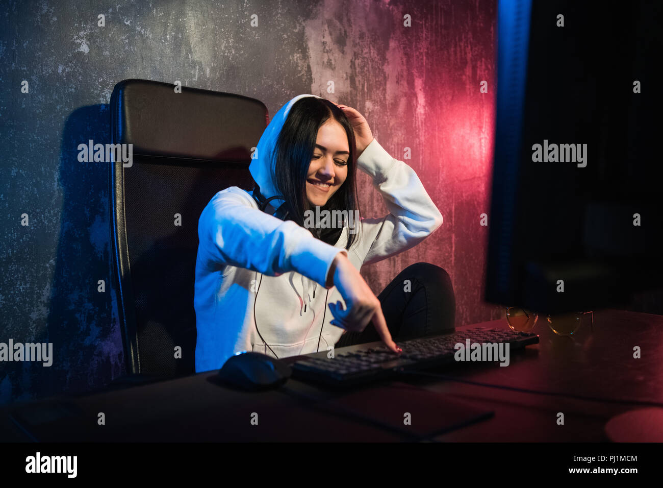 Excited female gamer girl woman pressing a button on a keyboard running ...