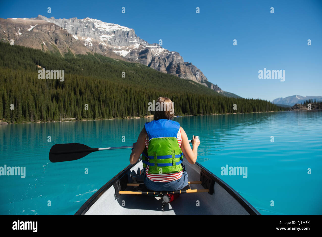 Woman riding boat in river Stock Photo - Alamy