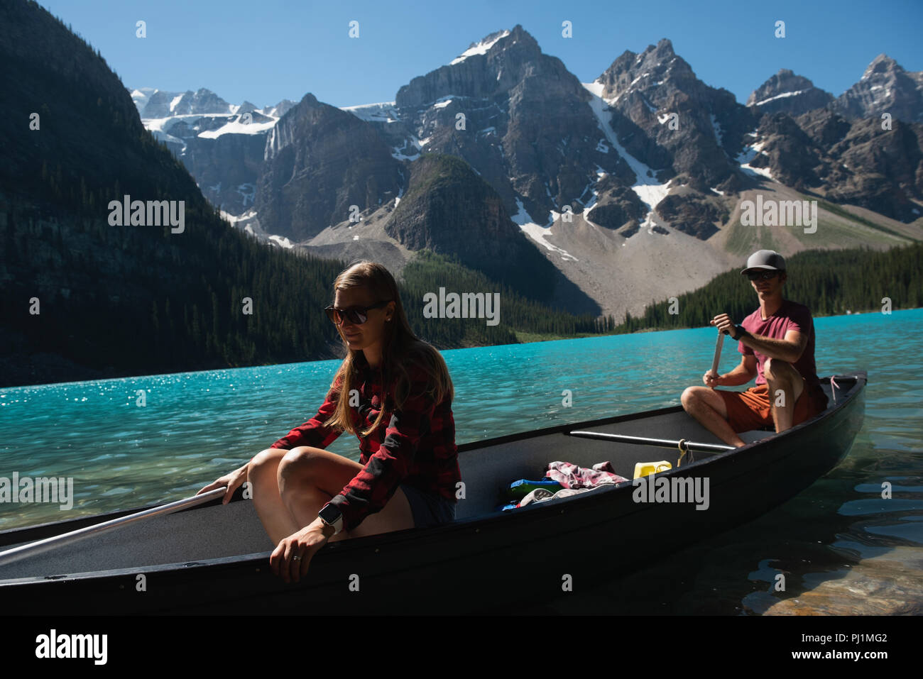 Couple boating in river Stock Photo - Alamy