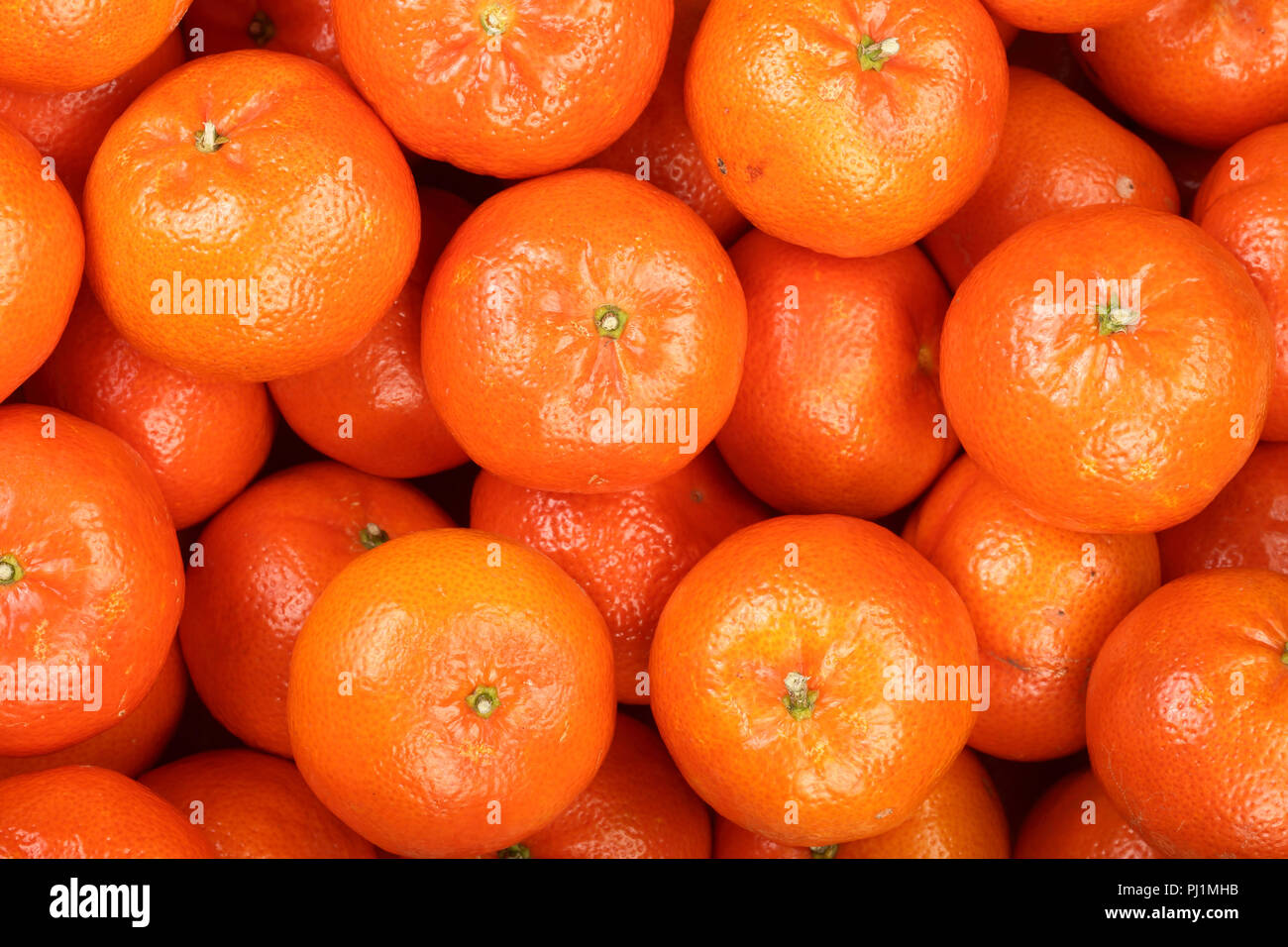Mandarin, tangerines in the market as a background close-up Stock Photo ...