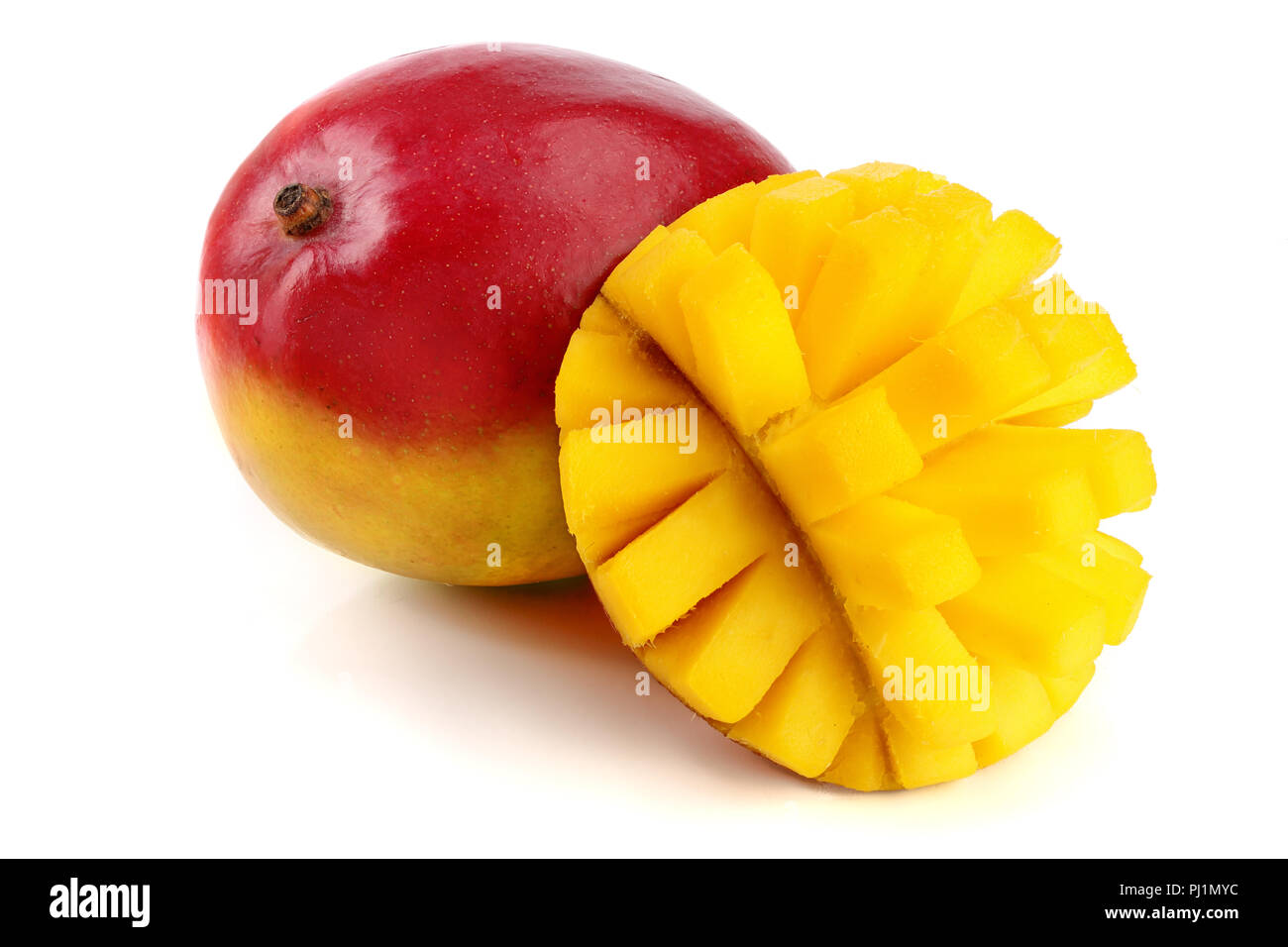 Mango fruit and half isolated on white background close-up Stock Photo ...