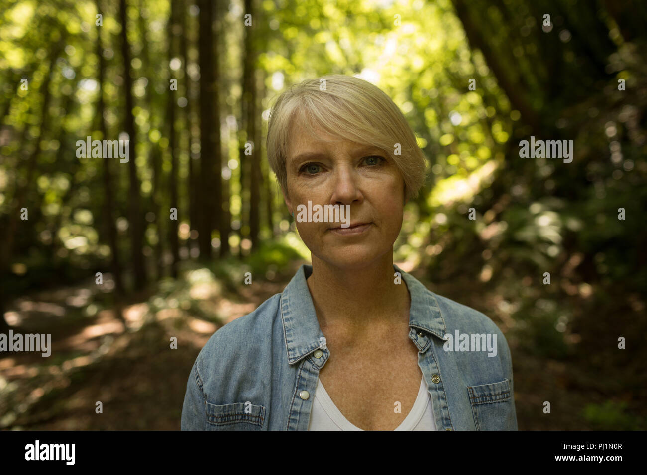 Woman in 50s standing hi-res stock photography and images - Alamy