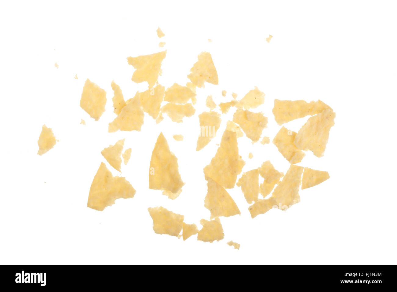 Potato chips crumbs and leftovers isolated over the white background ...