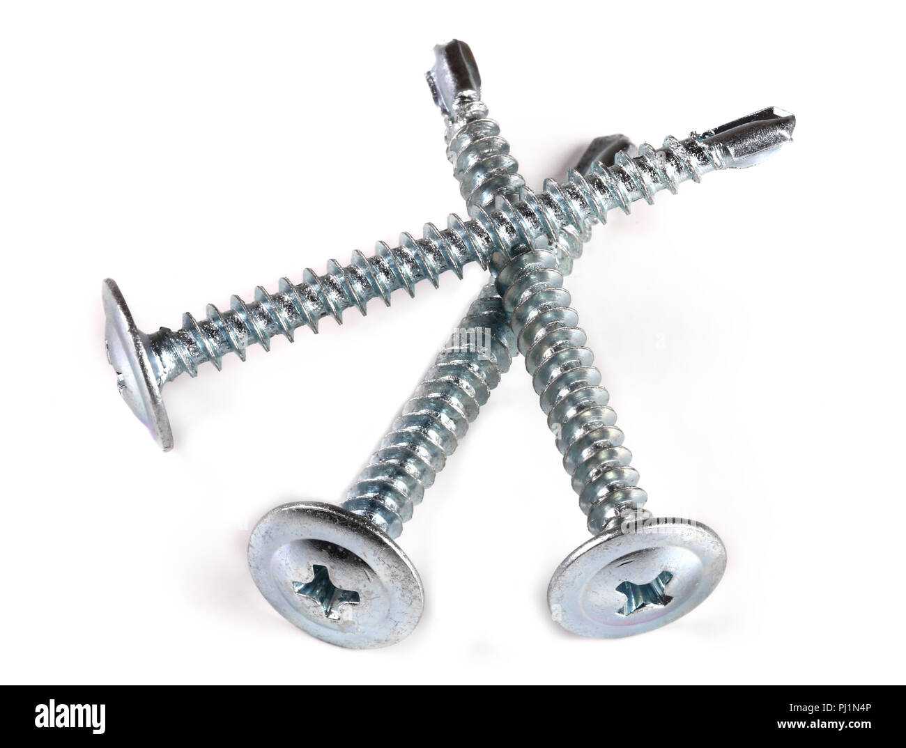three metal screws isolated on white background closeup Stock Photo - Alamy
