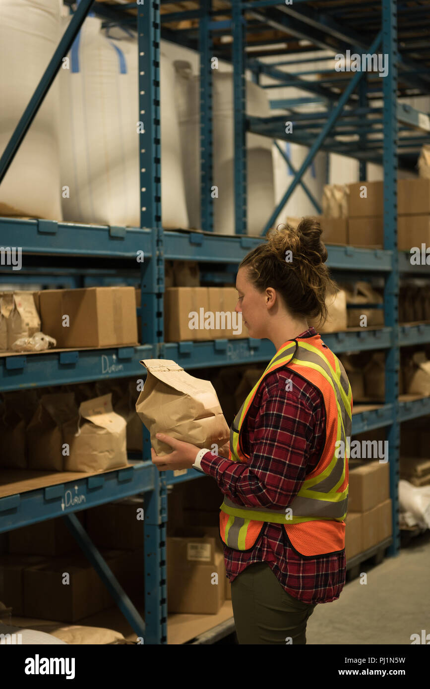 Female worker examining stock Stock Photo - Alamy