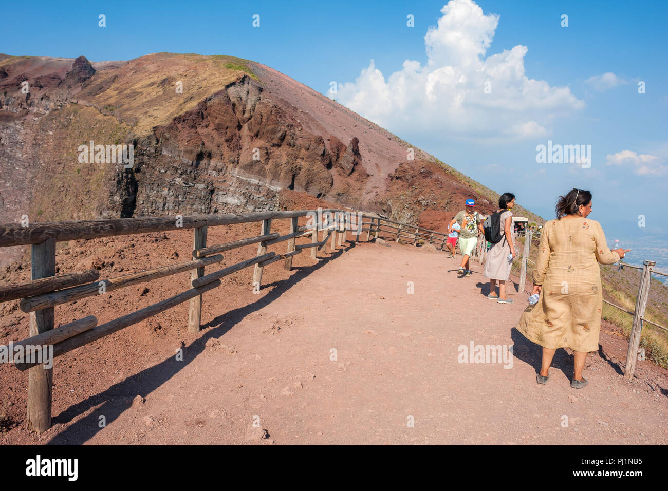 MOUNT VESUVIUS, ITALY - AUGUST 1, 2018: Tourists walk around the crater ...