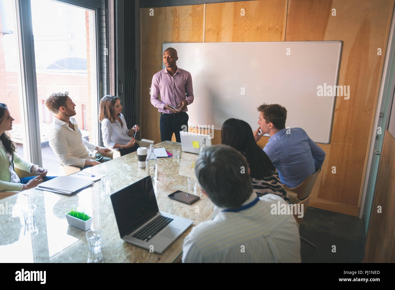 Business people having discussions in the meeting Stock Photo - Alamy