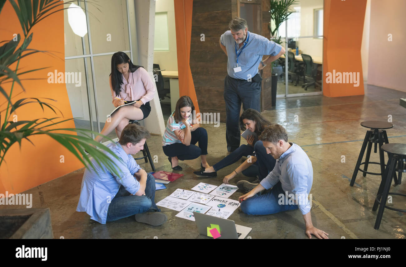 Business people discussing over documents Stock Photo - Alamy