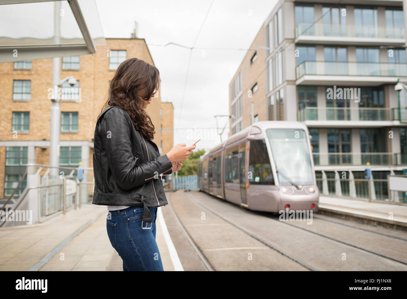 Woman in leather jacket using hi-res stock photography and images - Alamy