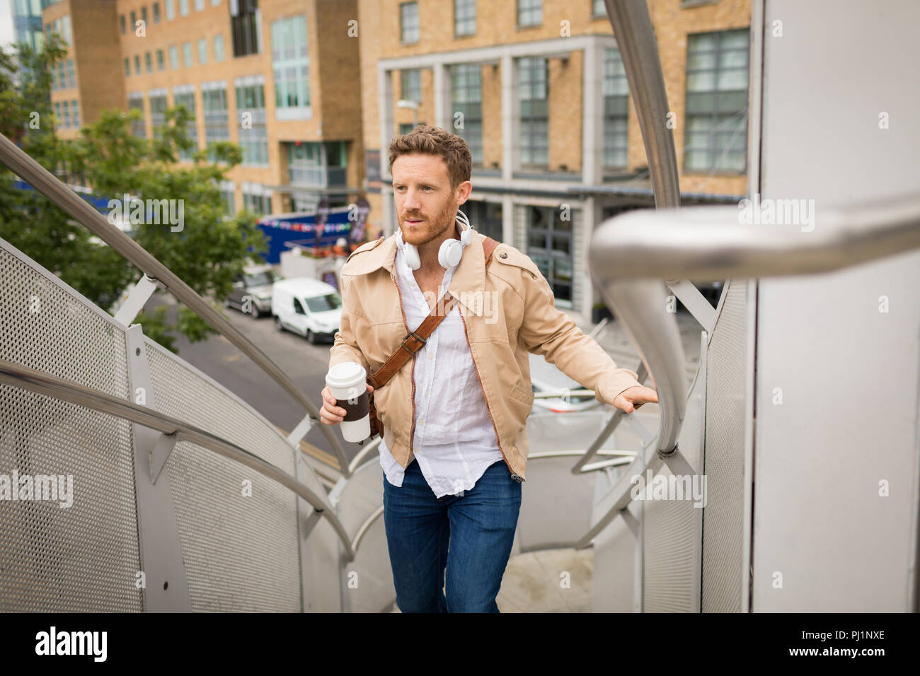 Man walking up stairs hi-res stock photography and images - Alamy