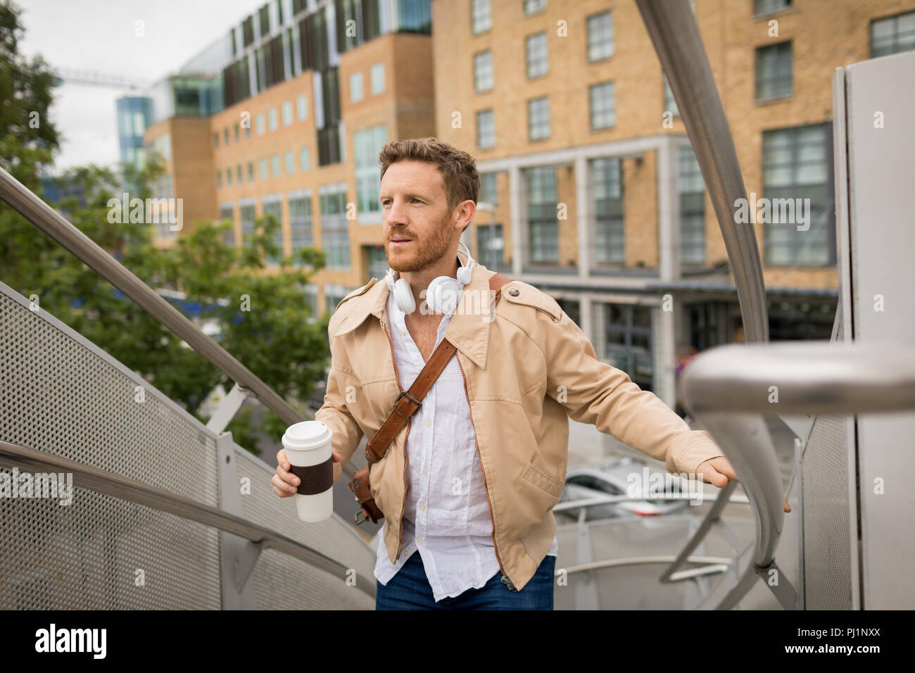 Man walking up stairs hi-res stock photography and images - Alamy