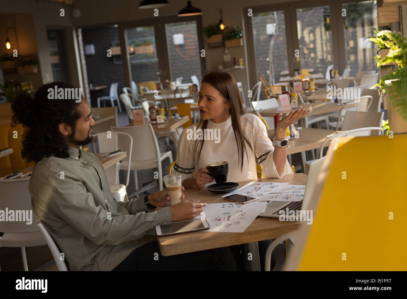 Business executive talking to each other Stock Photo - Alamy