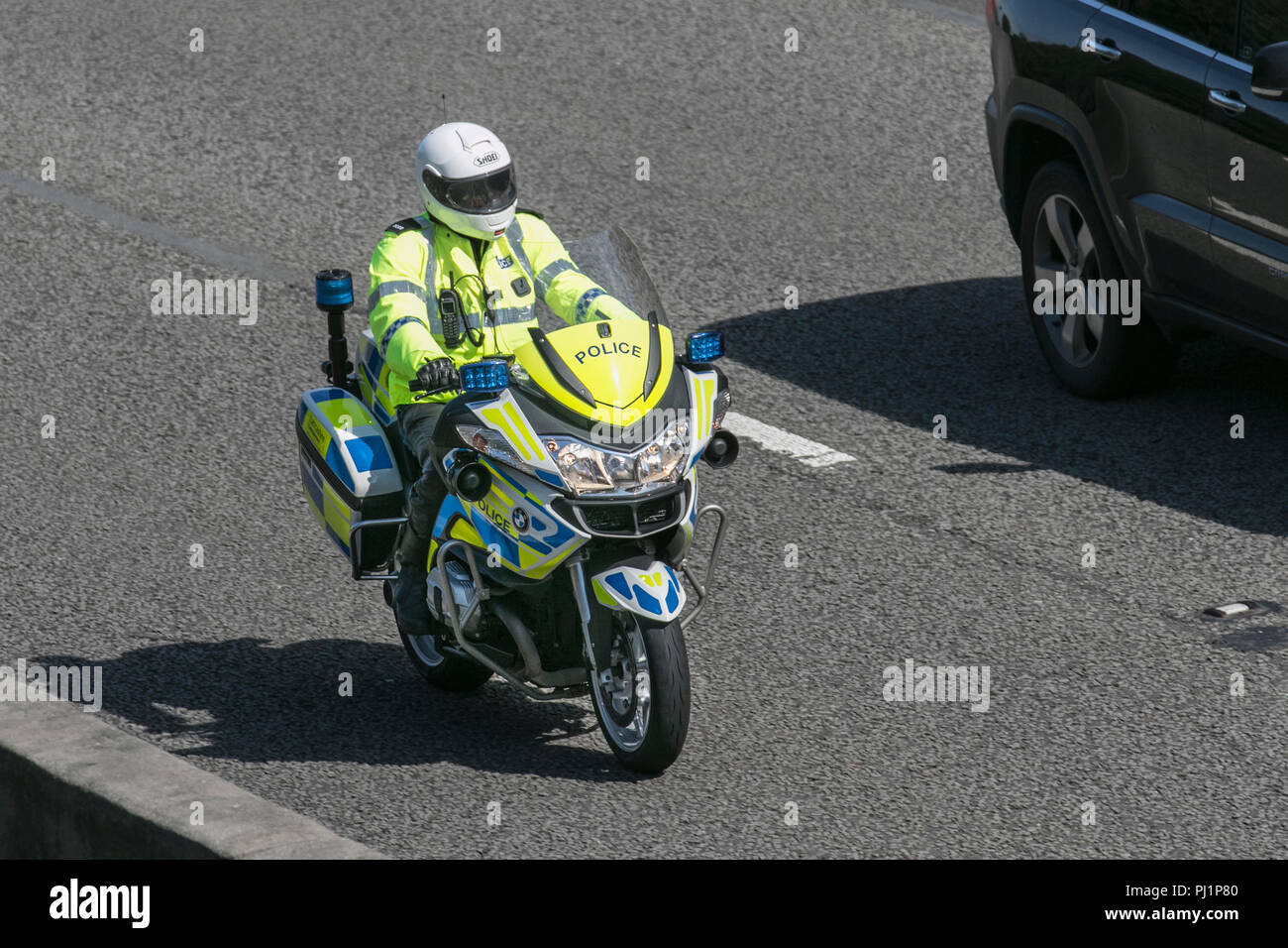 Police motorcyclists; BMW motorway patrol motorcyclist on the M6 ...