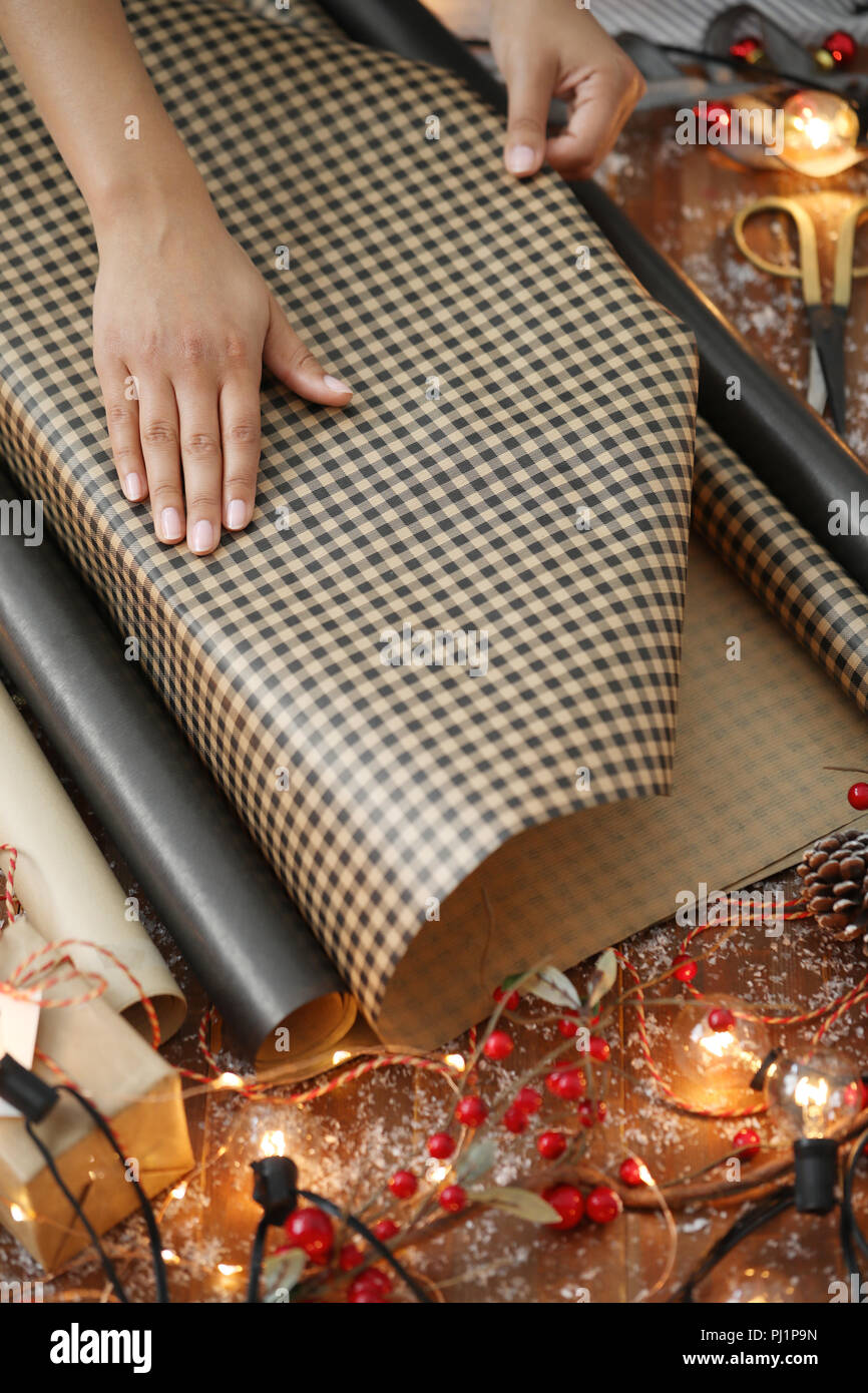 Christmas presents. Gift wrapping process Stock Photo - Alamy