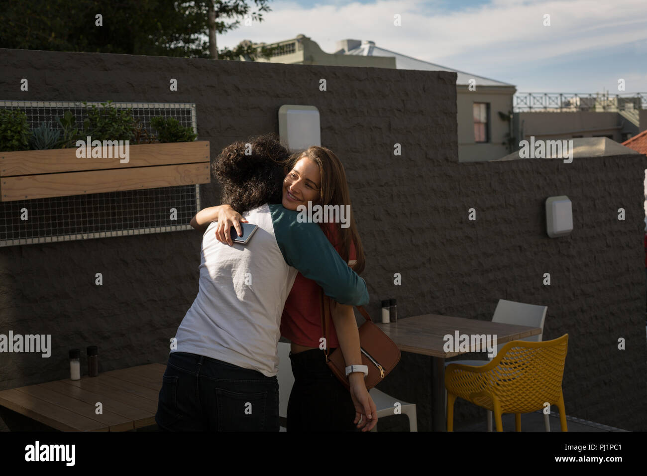 Young couple hugging chair hi-res stock photography and images - Alamy